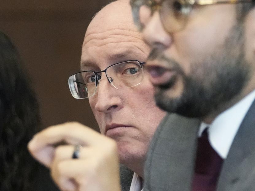 The father of a mass shooting suspect stands trial for helping him get ...