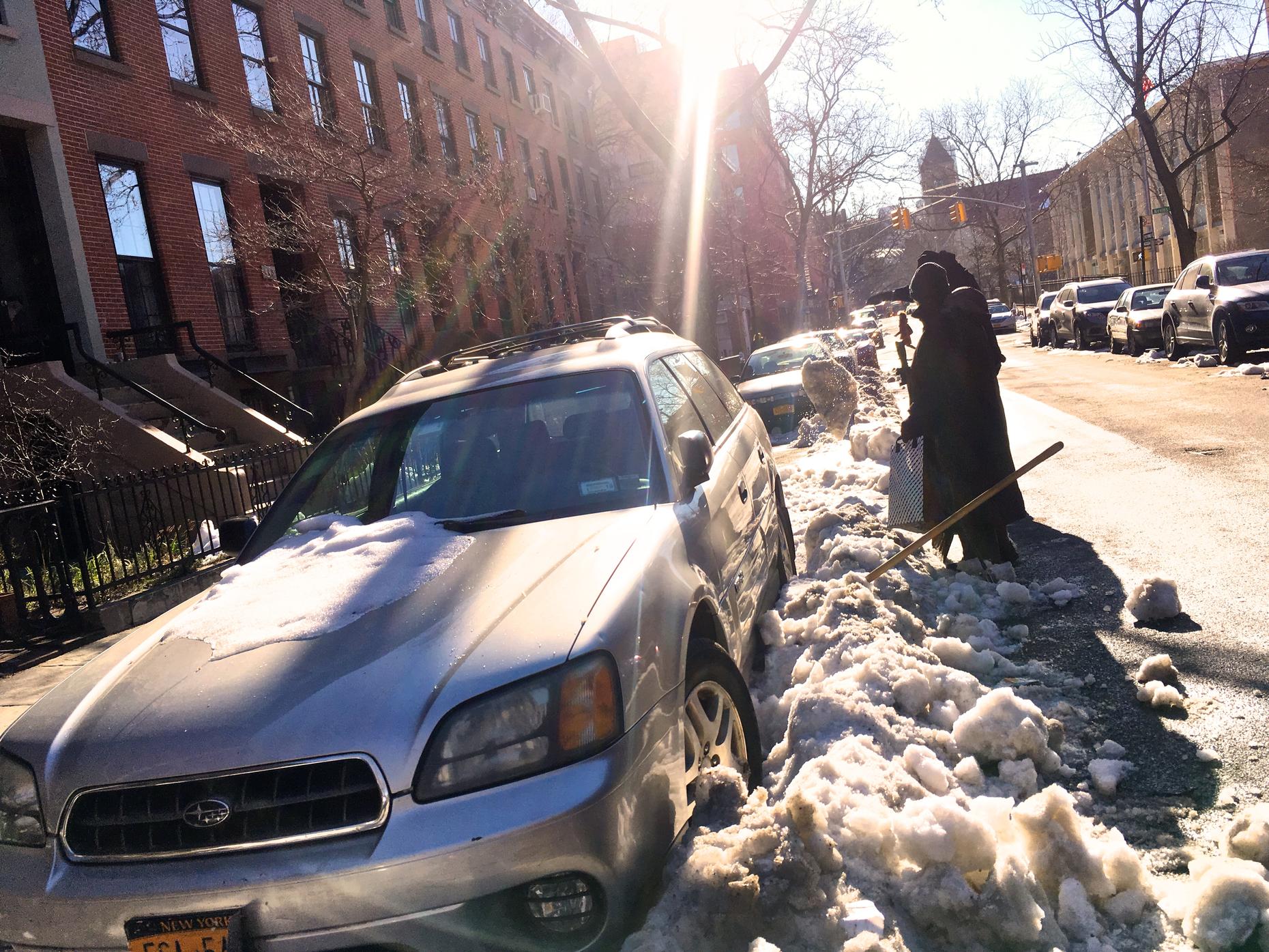 Digging Out A Snow Covered Car