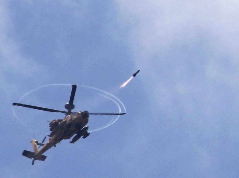Apache Helicopter Firing Rockets